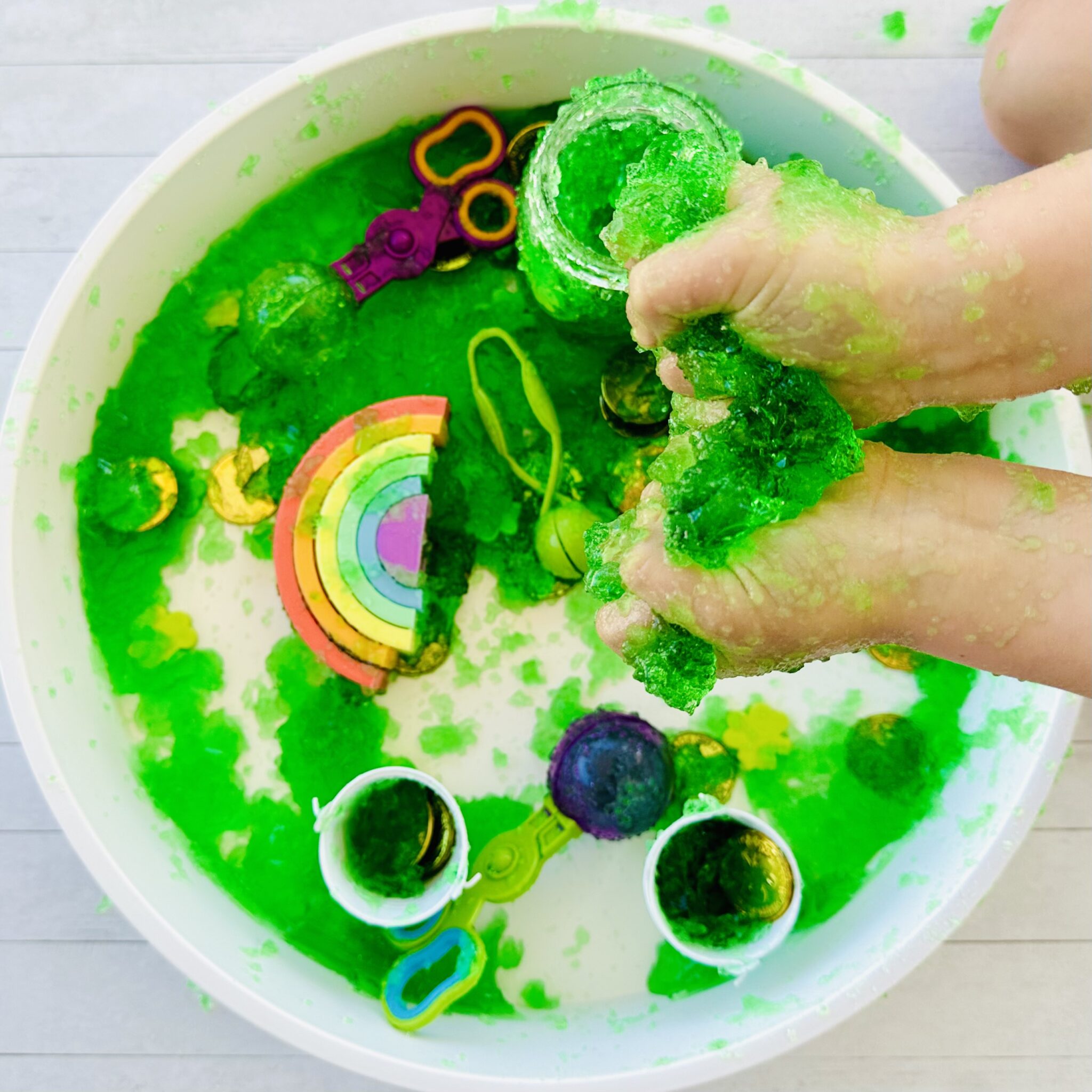 The BEST St. Patrick's Day Jello Sensory Bin - Raising Wild Things Sensory