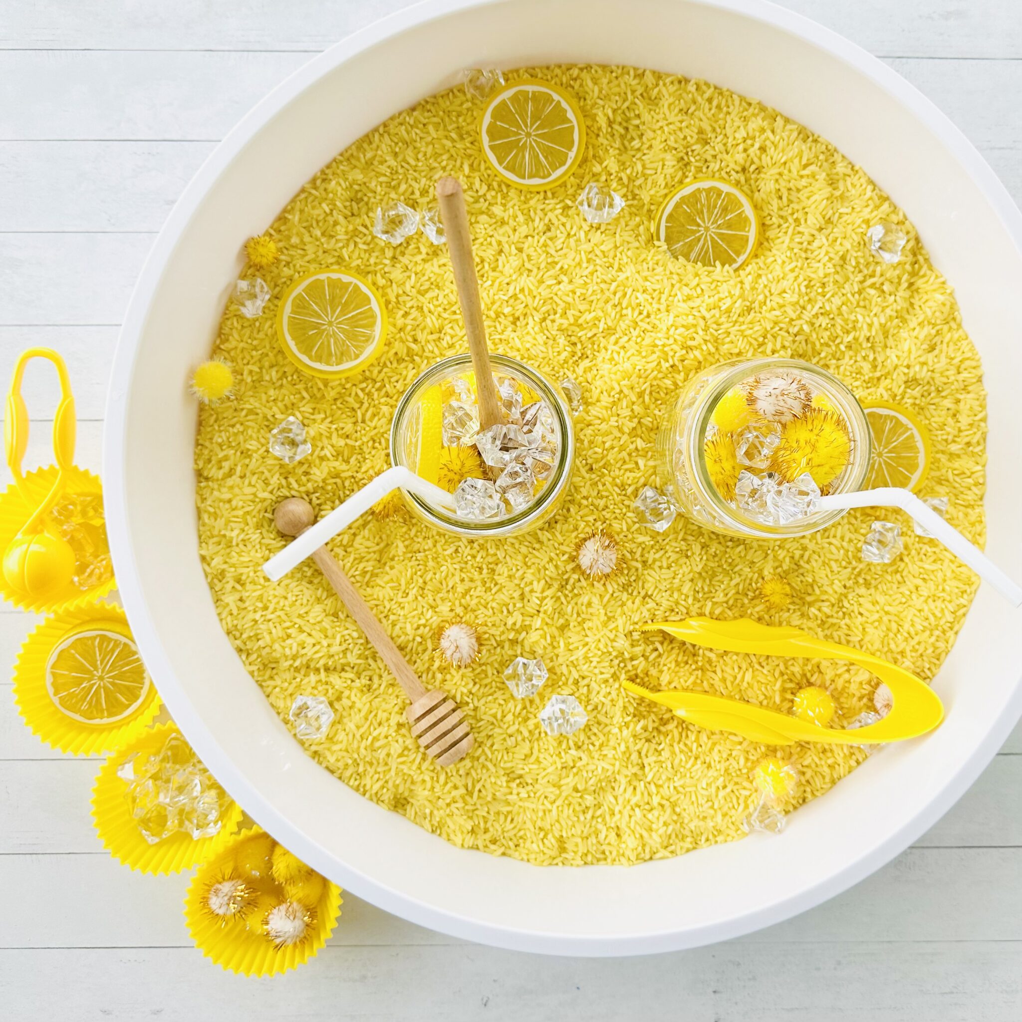 How To Make Lemonade Colored Rice Sensory Bin - Raising Wild Things Sensory