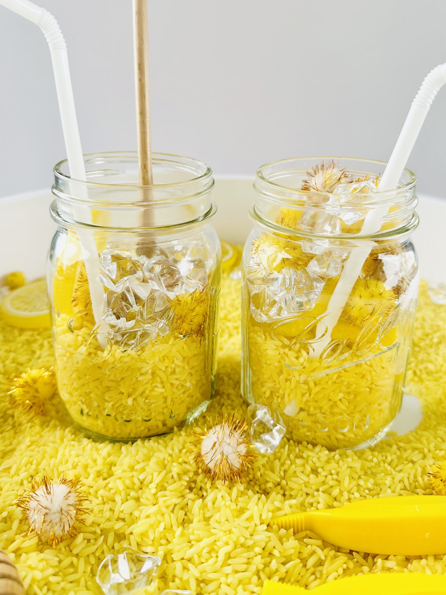 How To Make Lemonade Colored Rice Sensory Bin - Raising Wild Things Sensory