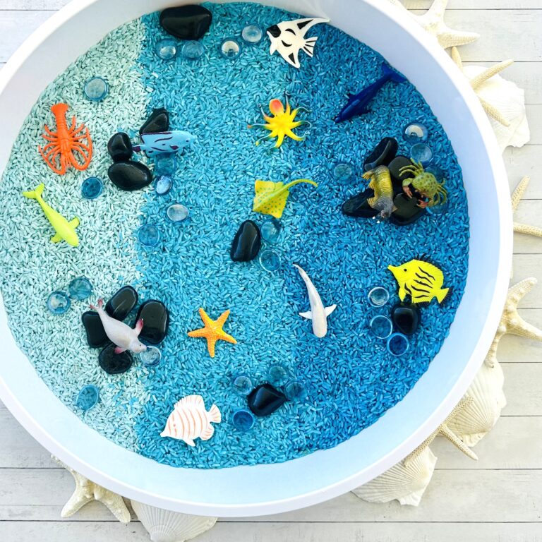 How To Make An Ocean Colored Rice Sensory Bin - Raising Wild Things Sensory