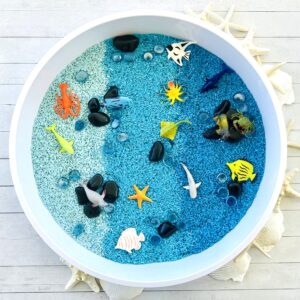 How To Make An Ocean Colored Rice Sensory Bin - Raising Wild Things Sensory