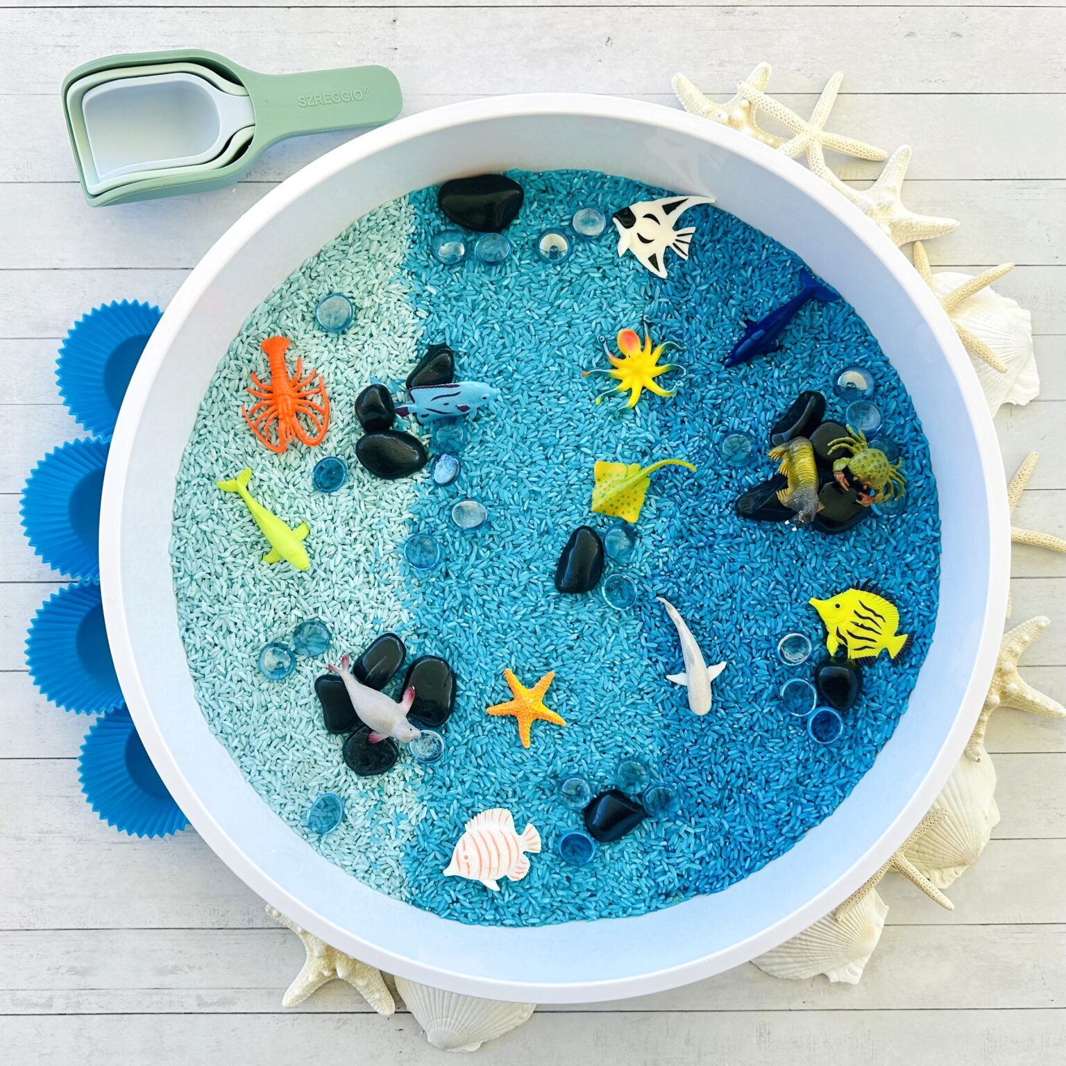 How To Make An Ocean Colored Rice Sensory Bin - Raising Wild Things Sensory