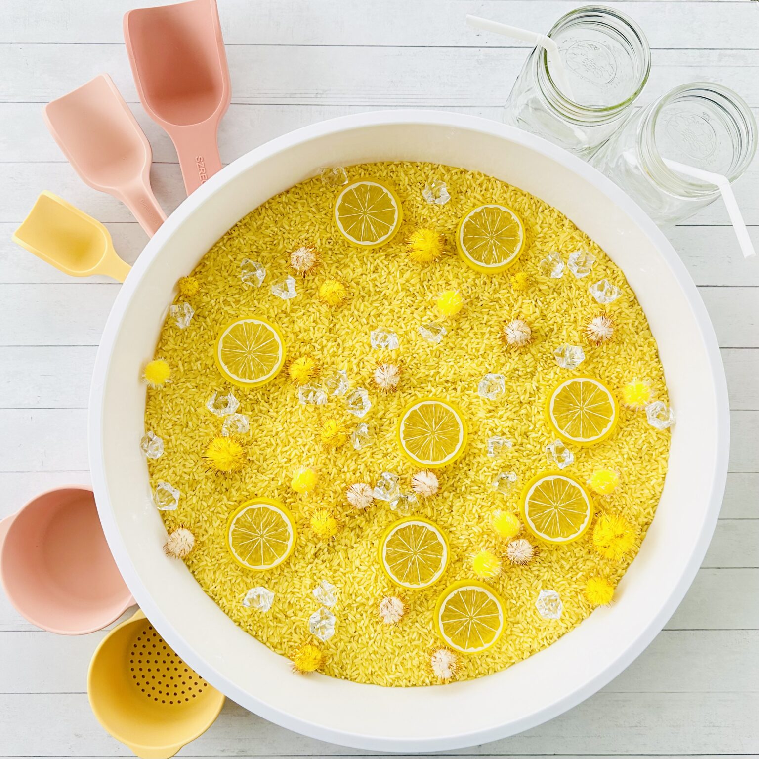 How To Make Lemonade Colored Rice Sensory Bin - Raising Wild Things Sensory