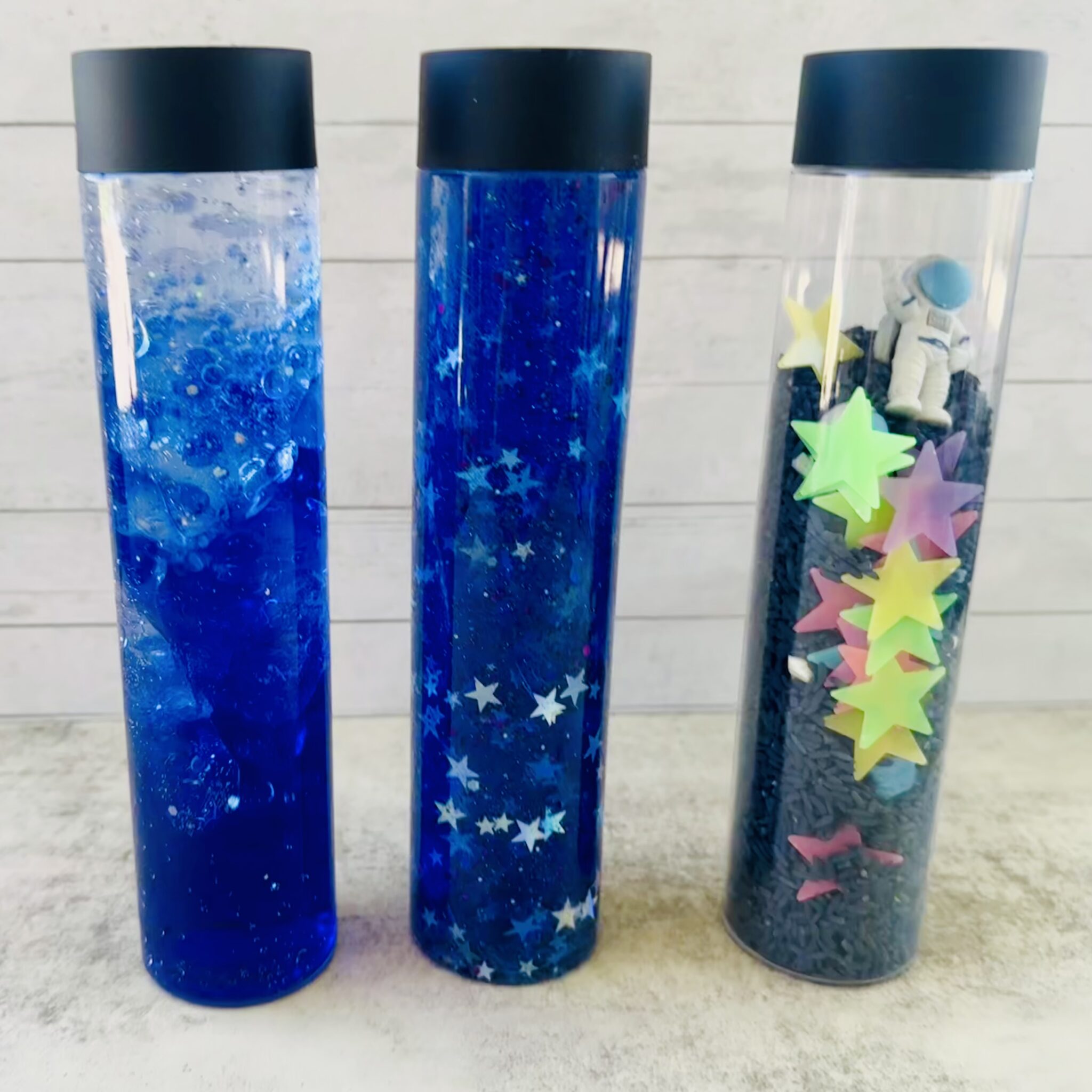 How To Make DIY Galaxy Sensory Bottles - Raising Wild Things Sensory