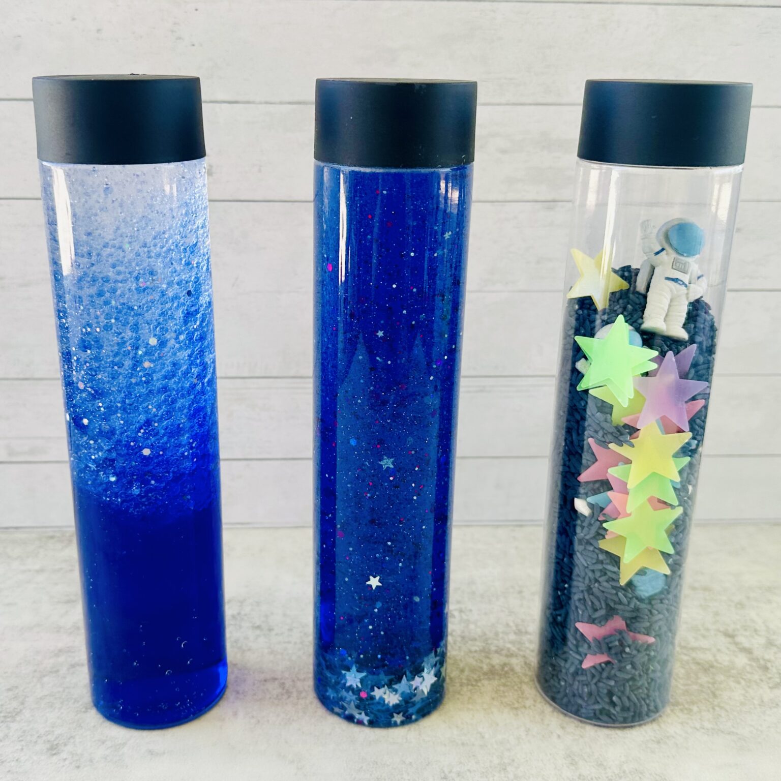 How To Make DIY Galaxy Sensory Bottles - Raising Wild Things Sensory