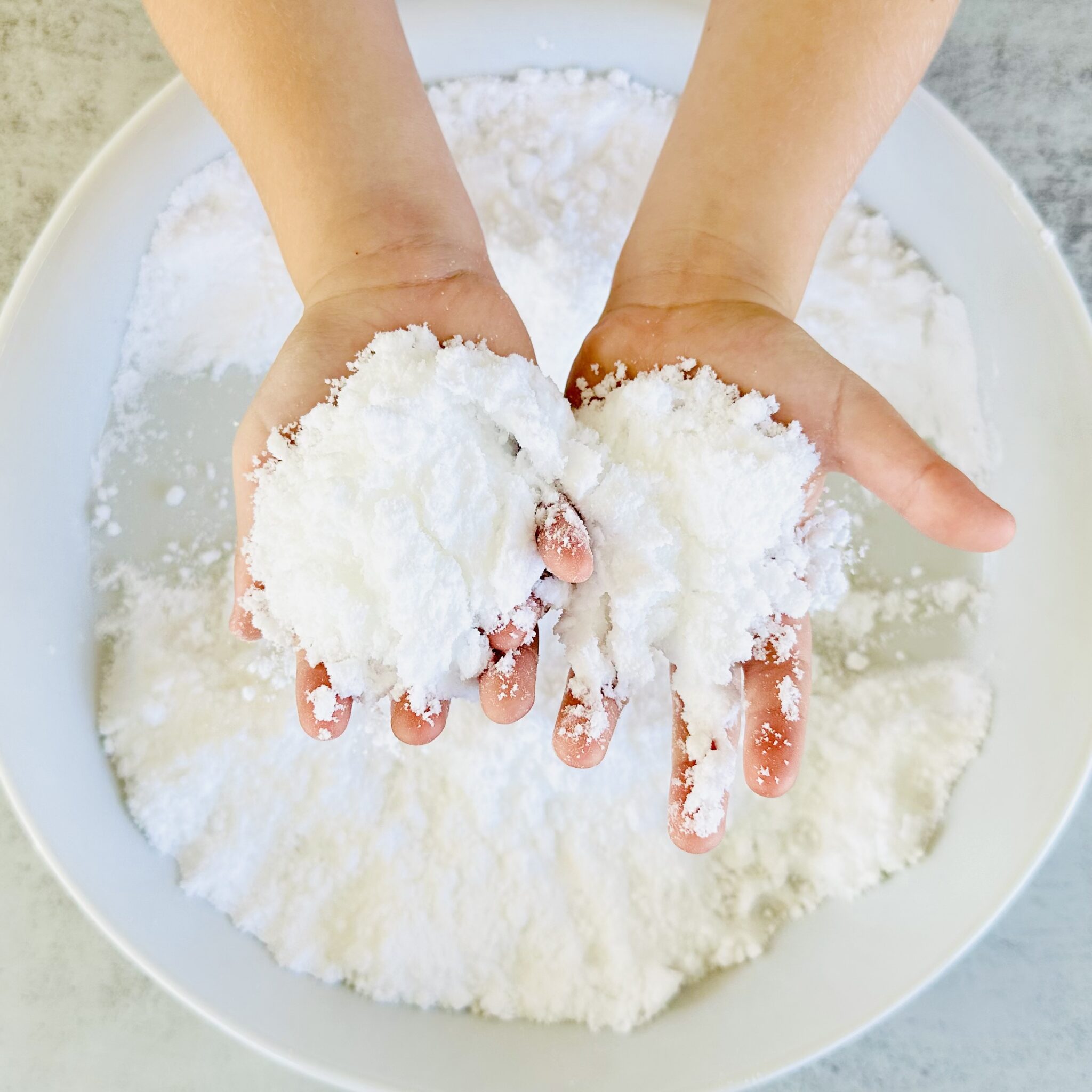 Snow Sensory Bin Using The Best DIY Fake Snow Recipe - Raising Wild ...