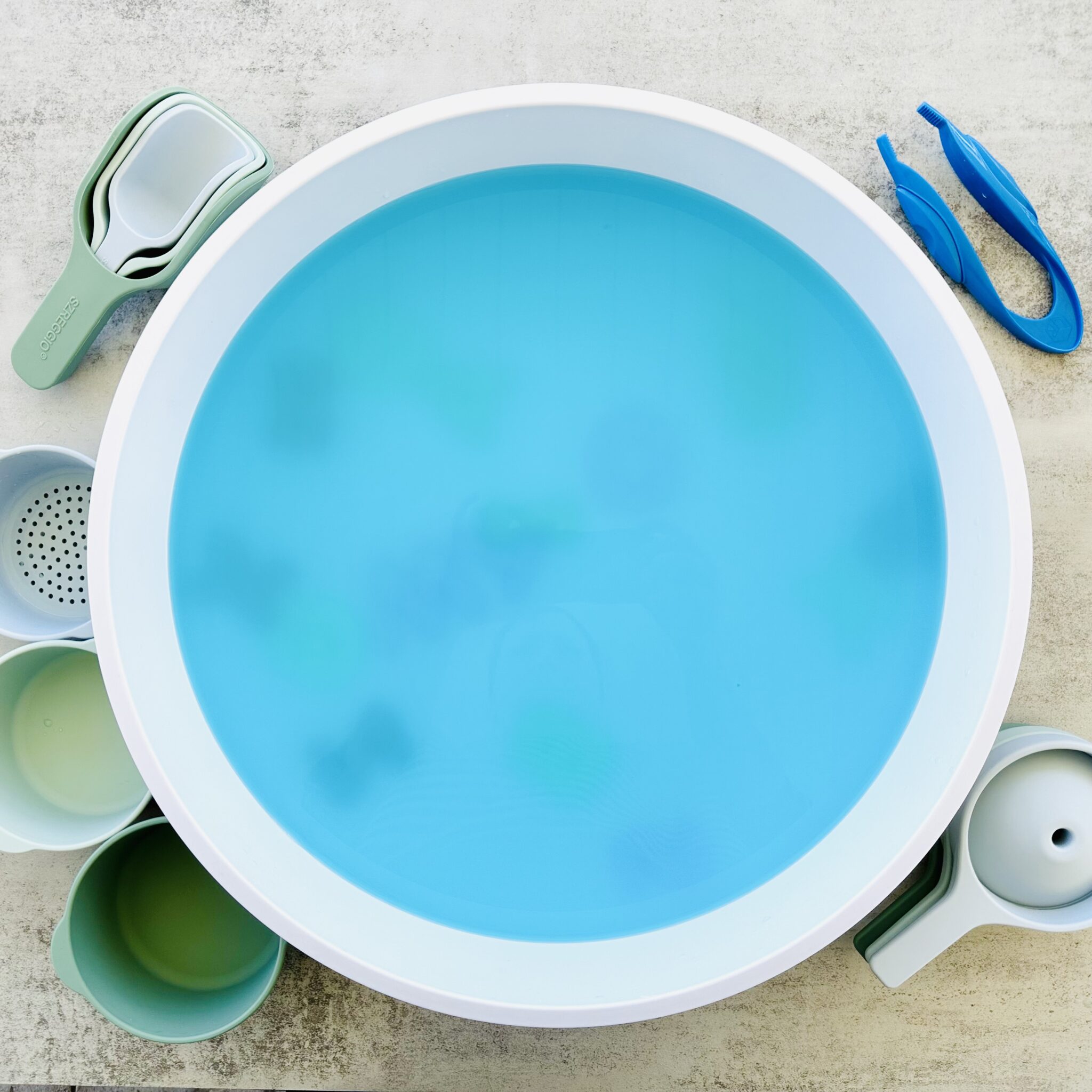 How To Make Mystery Water For Sensory Play - Raising Wild Things Sensory
