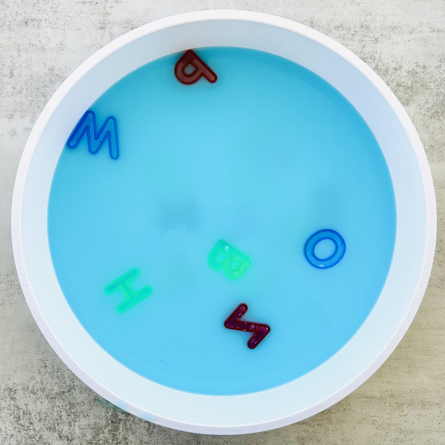 How To Make Mystery Water For Sensory Play - Raising Wild Things Sensory